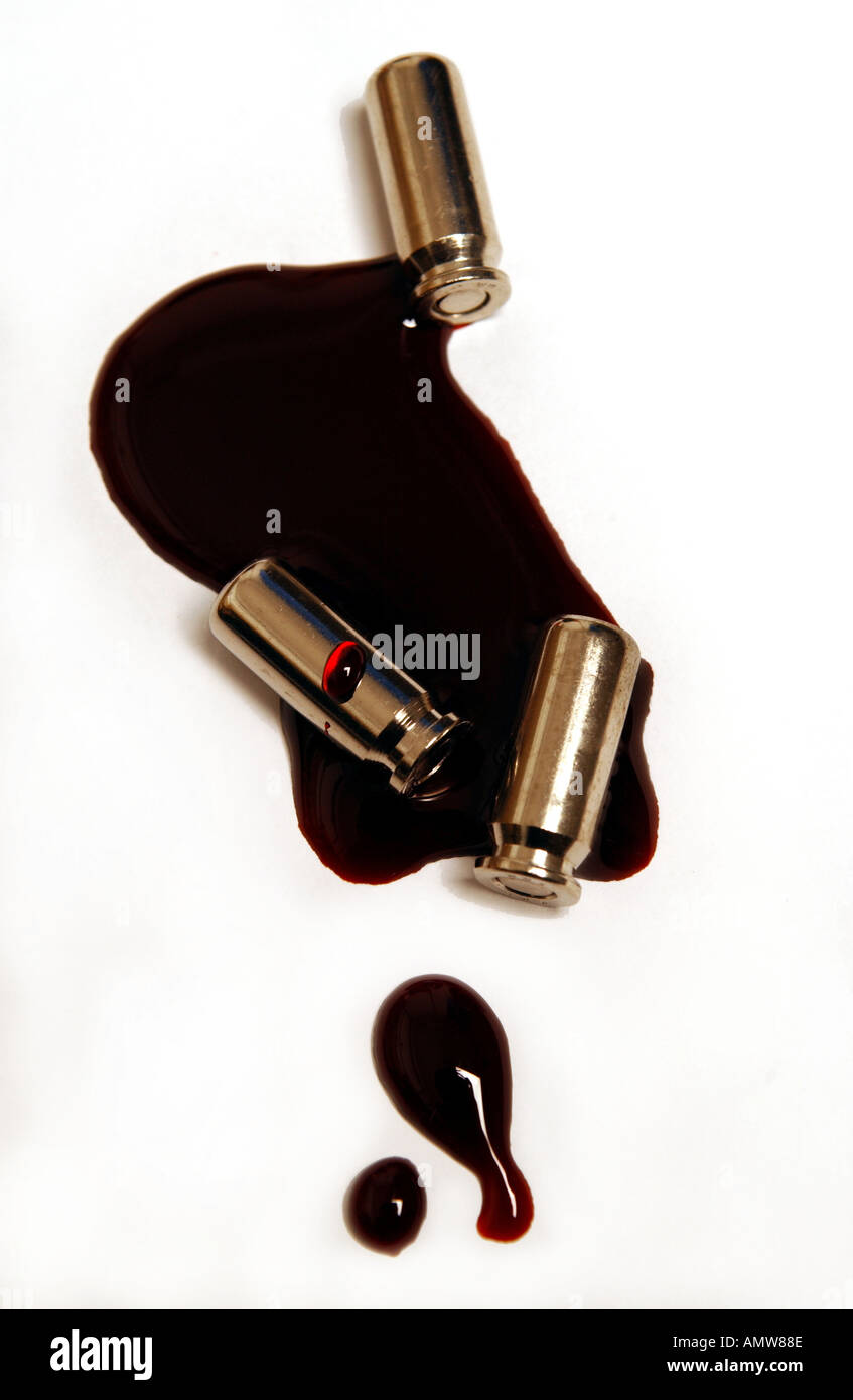 empty bullet casings with a blood stain Stock Photo - Alamy