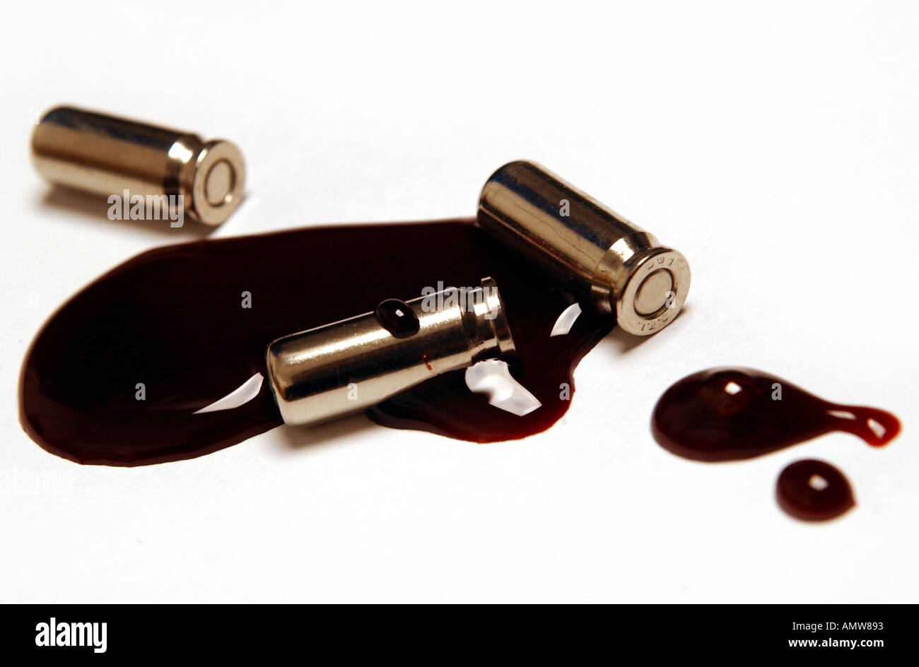 empty bullet casings with a blood stain Stock Photo - Alamy