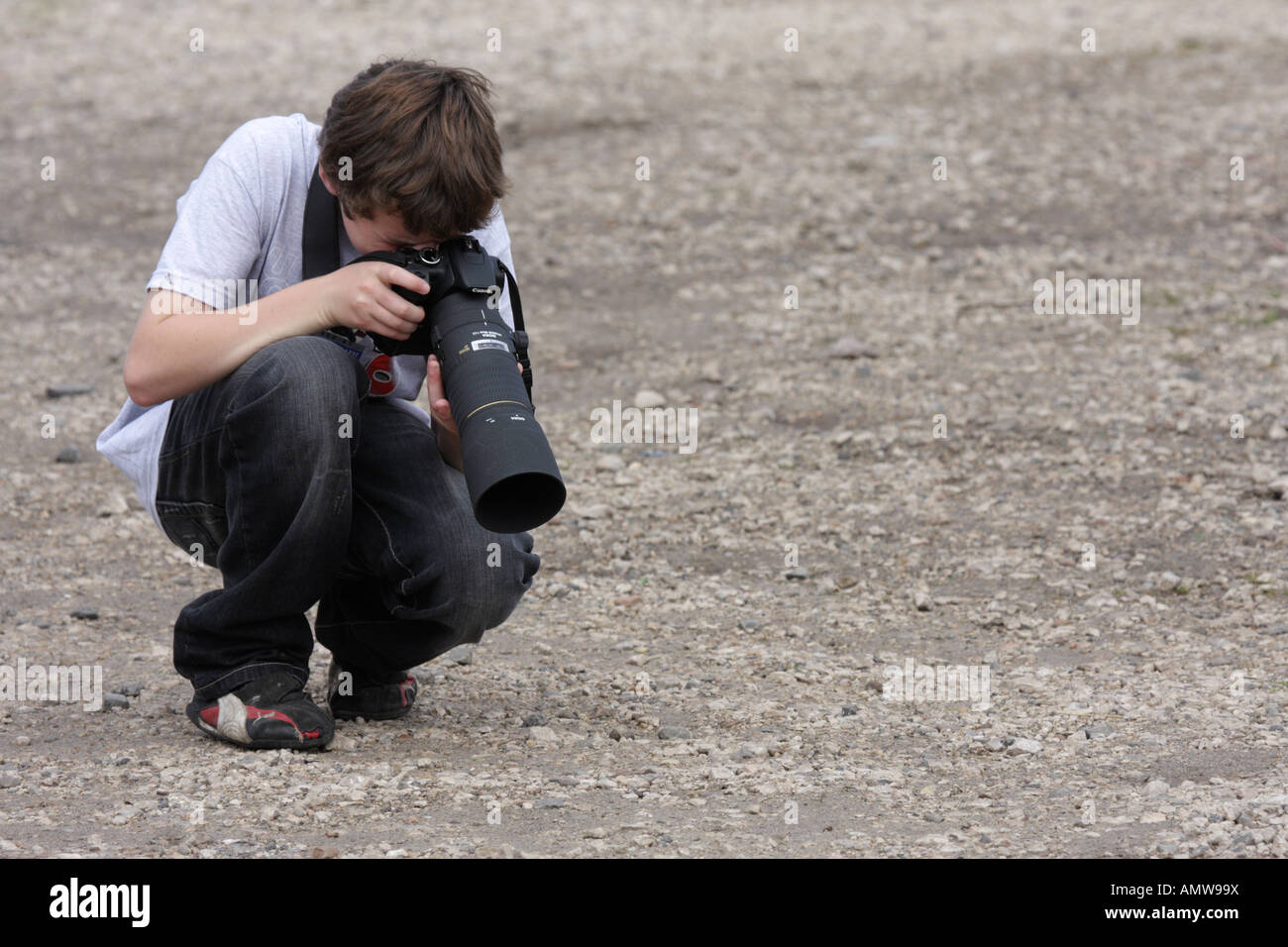 Person using macro photography lens on camera Stock Photo - Alamy
