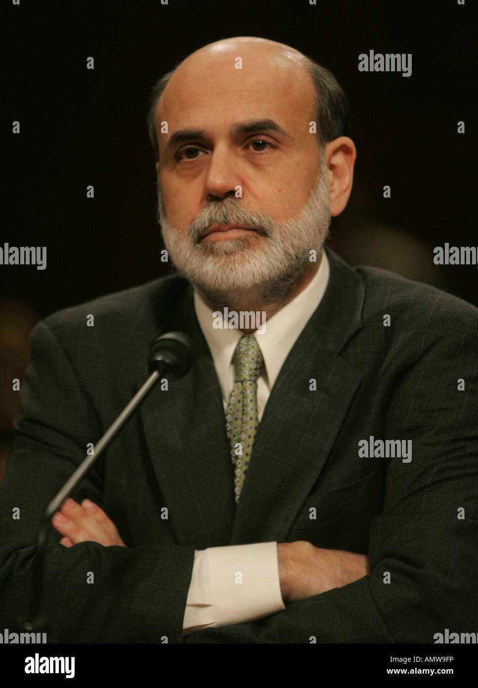 Federal Reserve Board Chairman Ben Bernanke answers a question at a ...