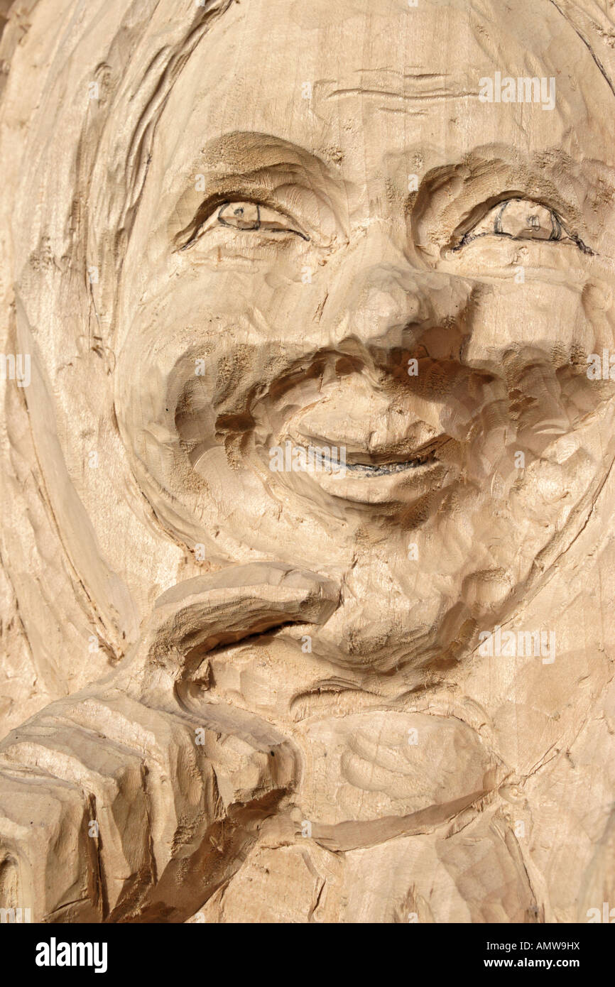 Wooden carving of an old woman Stock Photo - Alamy