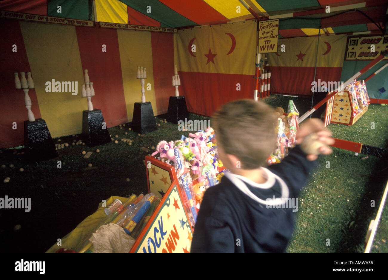 Boys play at a traditional funfair Stock Photo - Alamy
