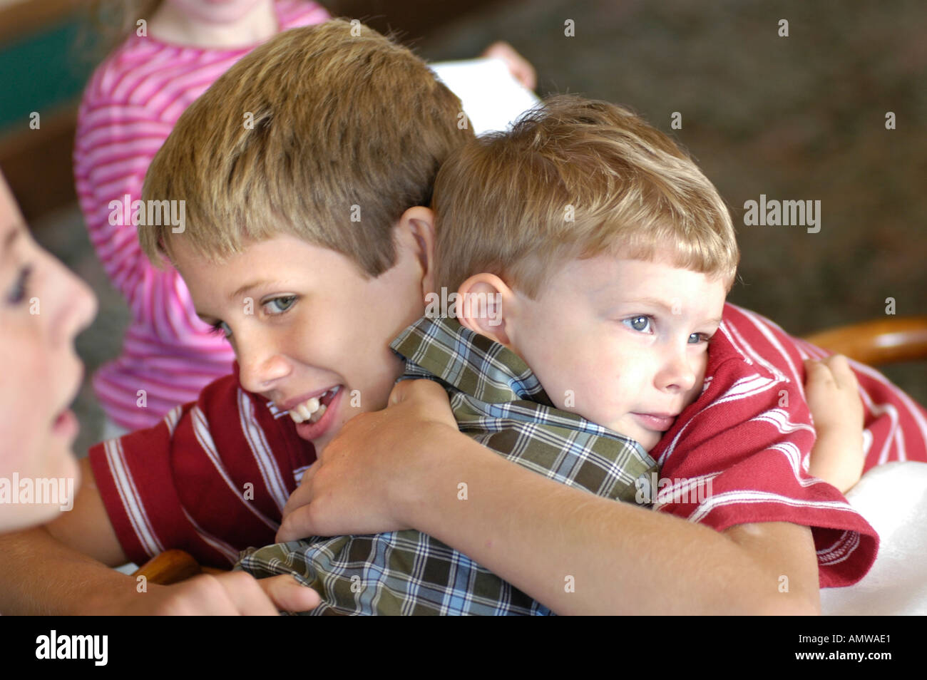 Kids in same family playing together at family gathering Brothers Stock ...