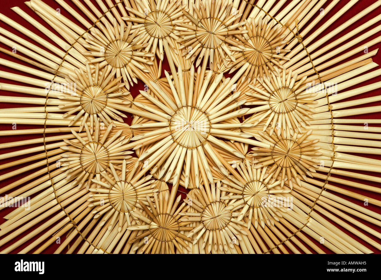 Straw star on red underground Stock Photo - Alamy