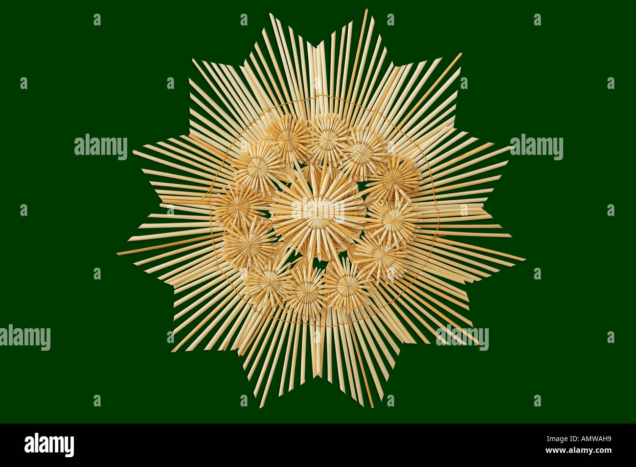 Straw star on green underground Stock Photo - Alamy