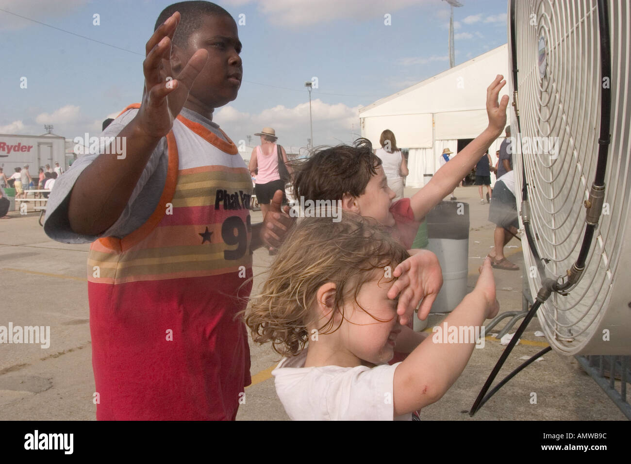 Fans blowing water cool of kids at the 2004 New Orleans Jazz and ...