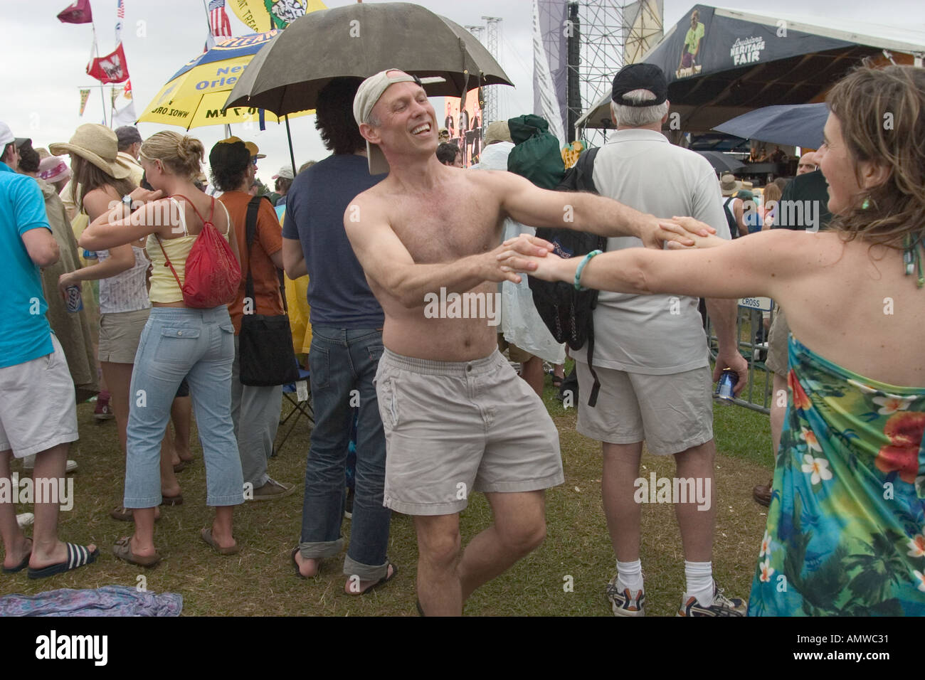 Revelers dance at the Acura Stage at the New Orleans Jazz and Heritage ...
