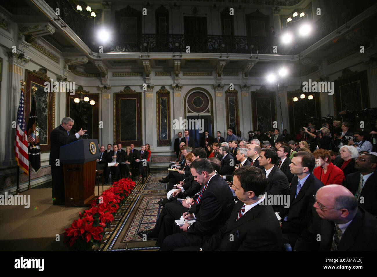 President George W Bush points to a reporter for a question during a ...