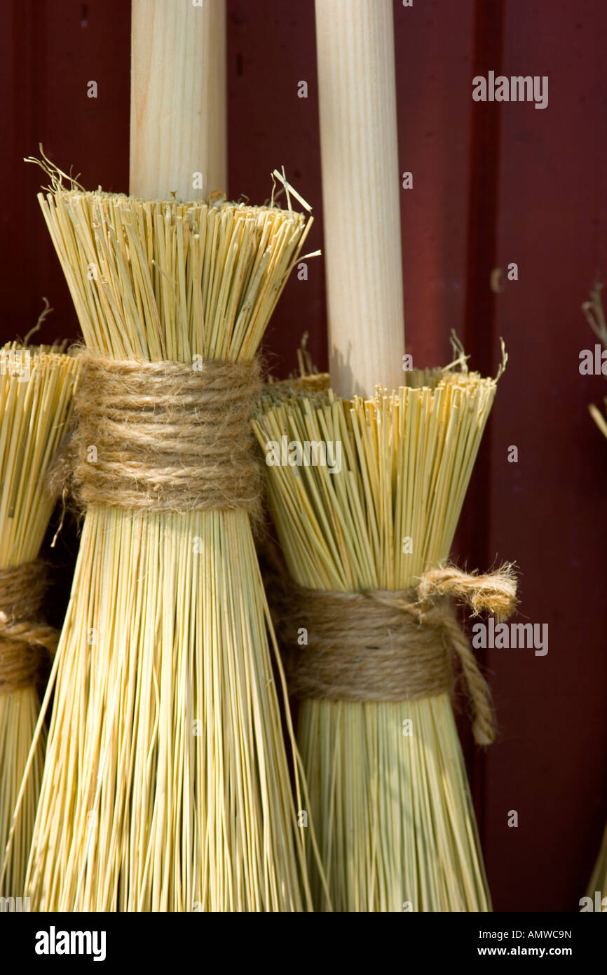 Brooms on display for sale at broom factory Stock Photo - Alamy