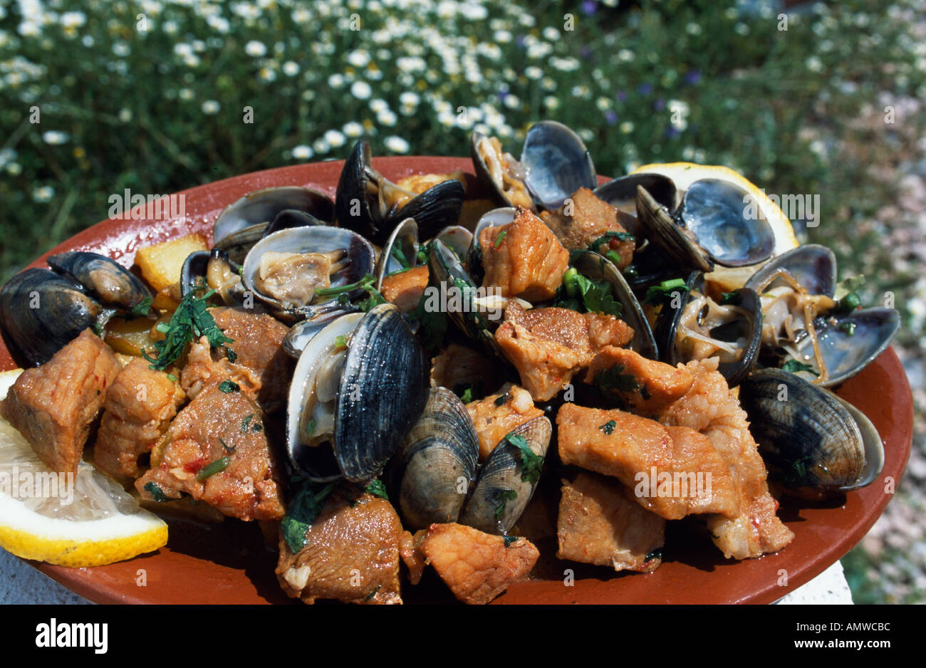 Pork and clams is a typical dish of the Alentejo Stock Photo - Alamy