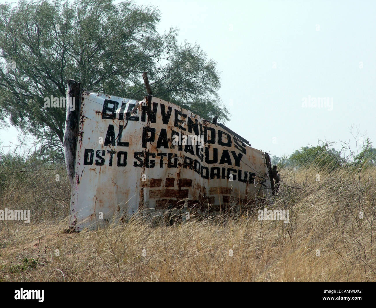 Paraguayan dented and rusted sign for welcoming people at the deserted ...