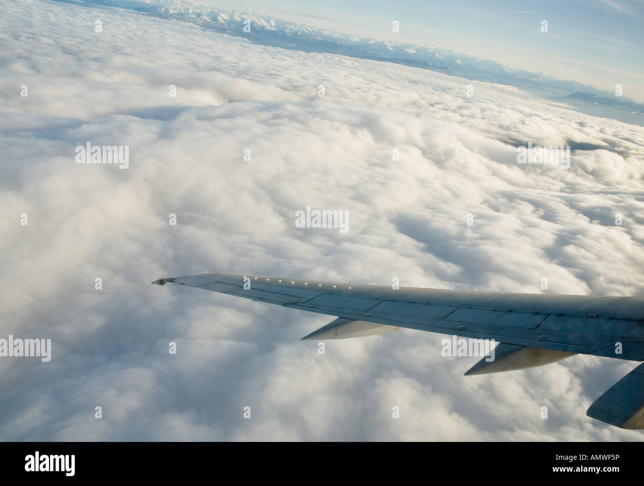 Airplane wing flying above fluffy hi-res stock photography and images ...