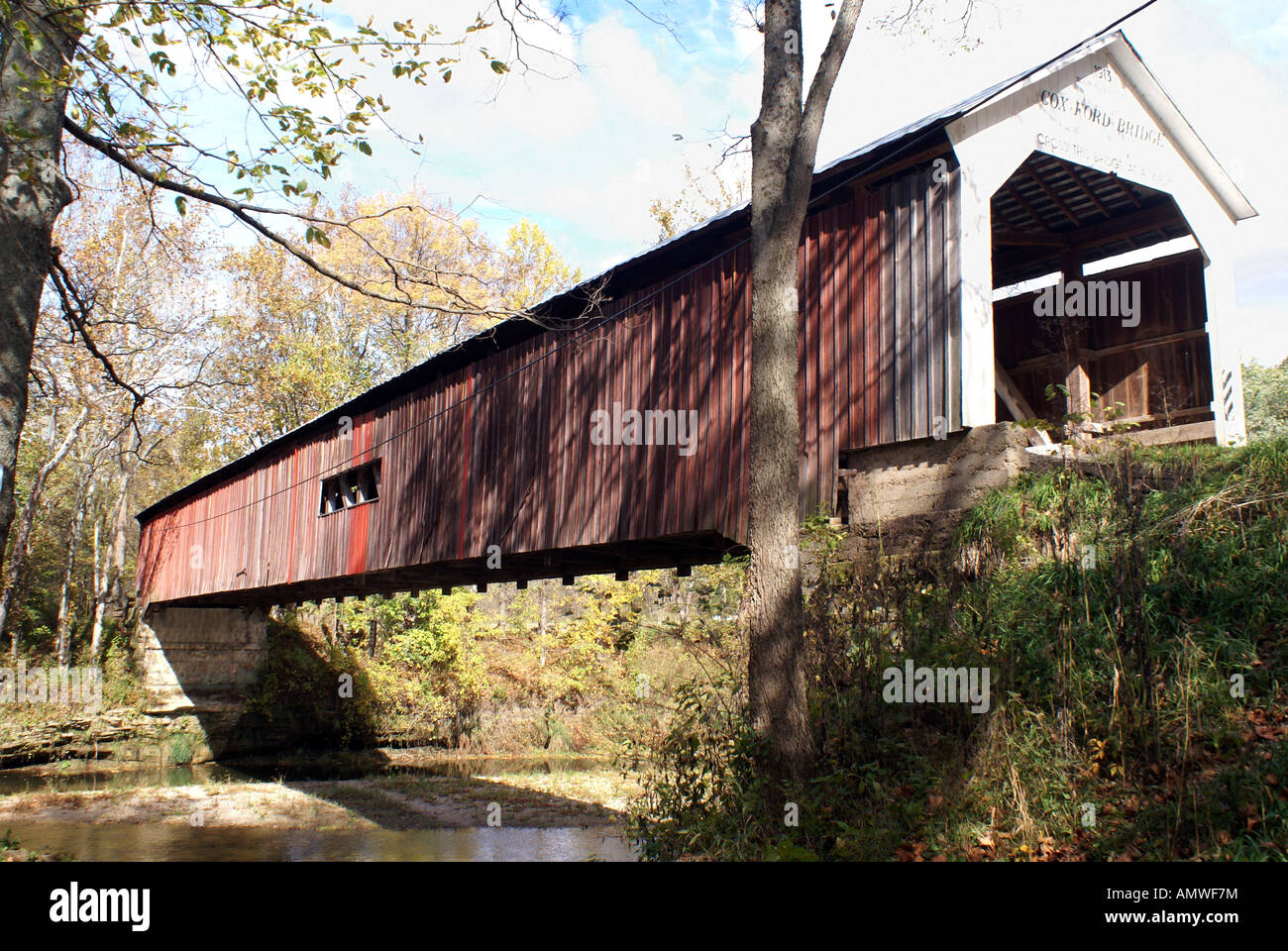 Red bridge over stream in hi-res stock photography and images - Alamy