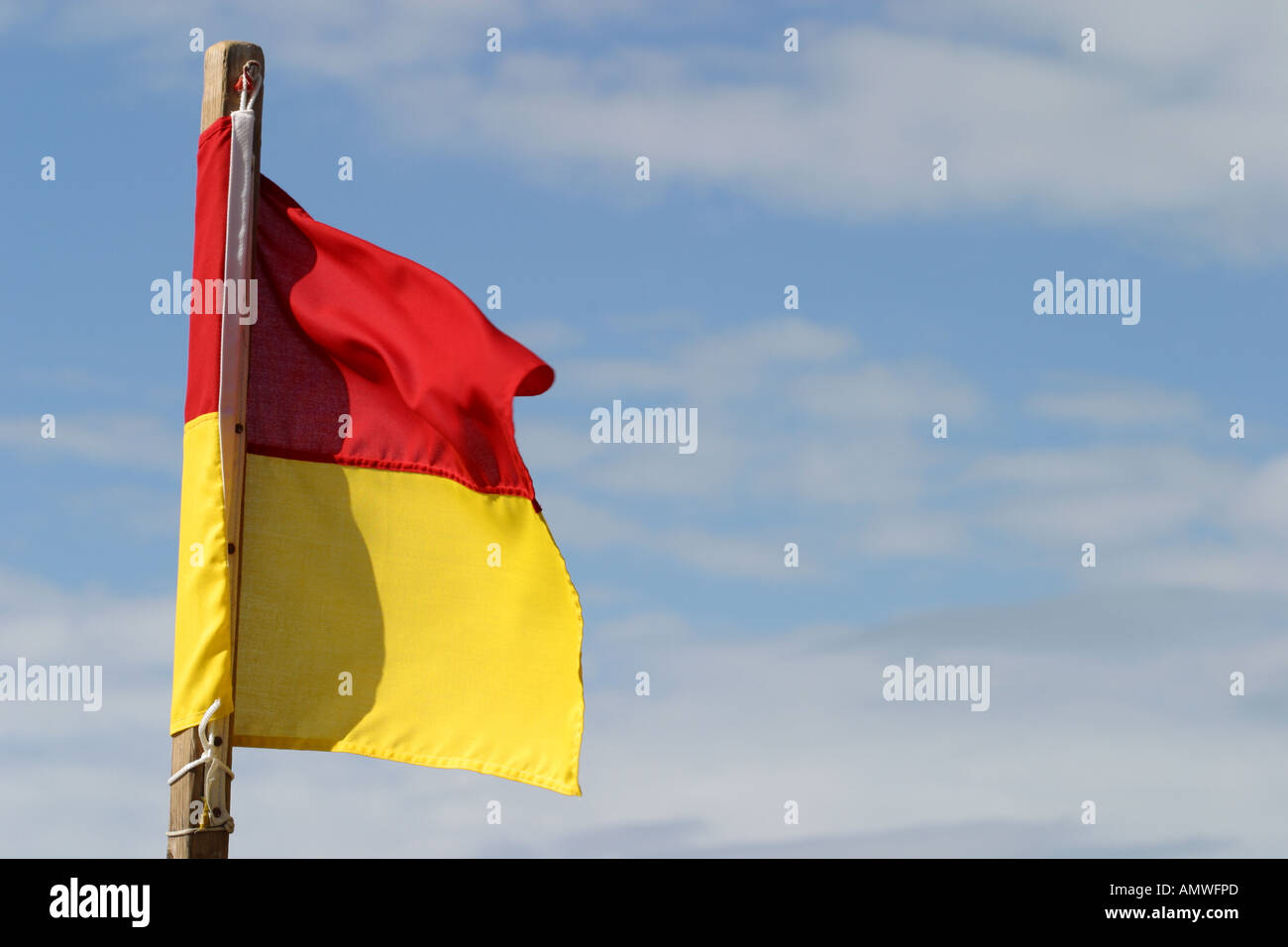 Beach sea warning flag red and yellow Stock Photo - Alamy