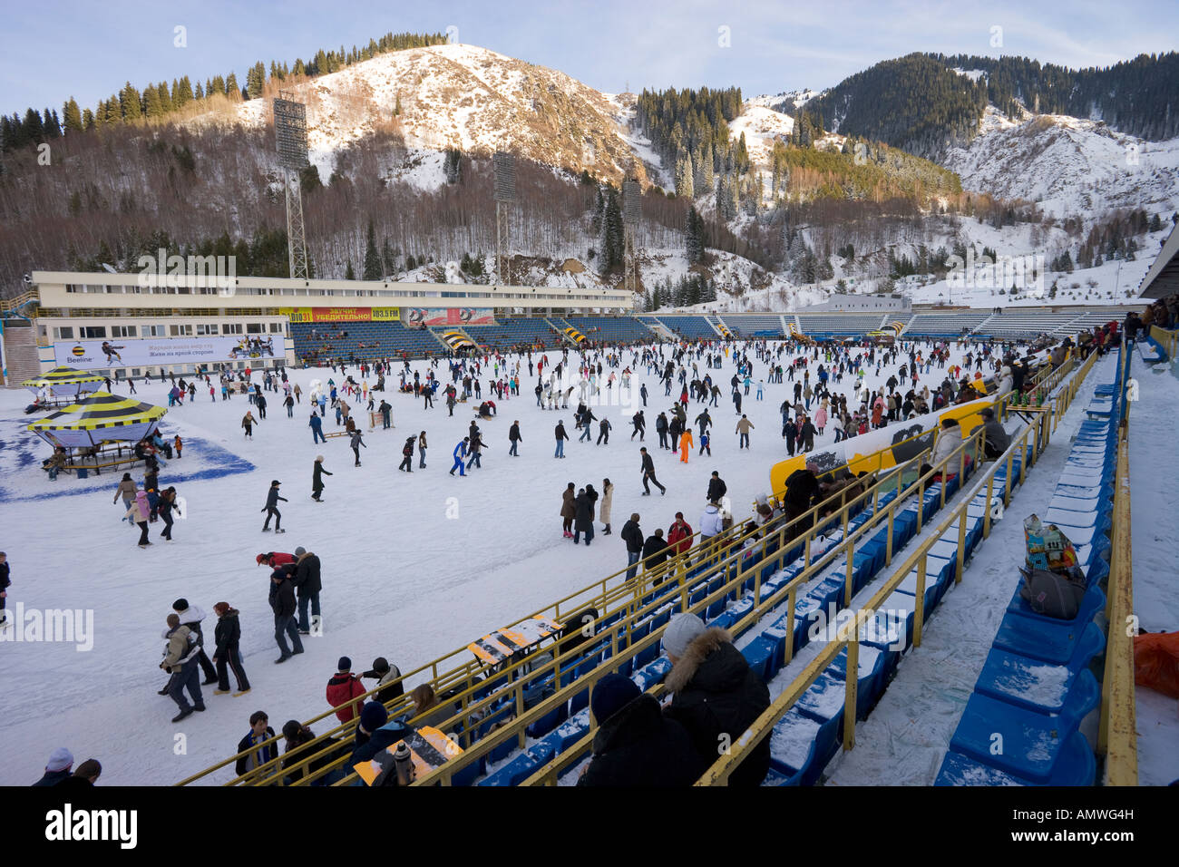 People skating at Medeo skating rink amongst mountains Kazakhstan Stock ...