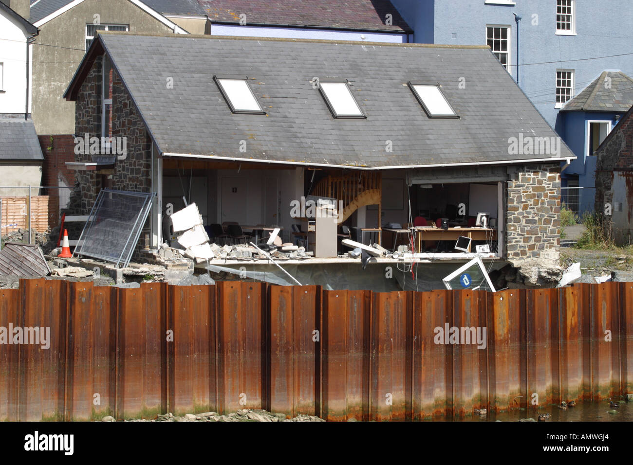 Building collapse into the River Aeron Ceredigon Wales caused by river ...