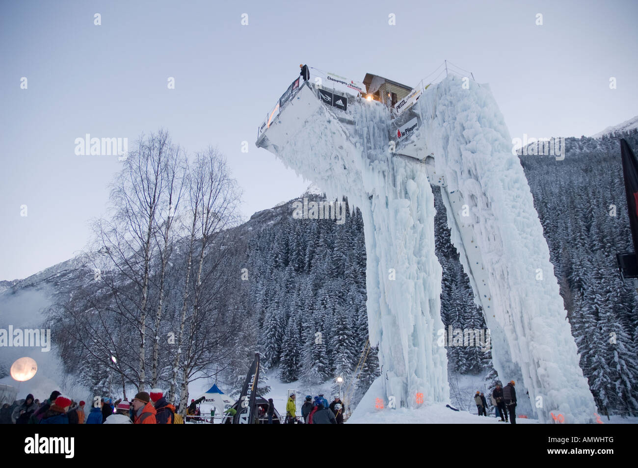 Spectators at Gorzderette ice climbing competition on ice tower at ...