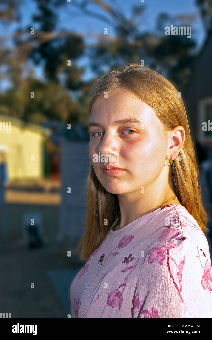 a stern young woman looks at the camera Stock Photo - Alamy