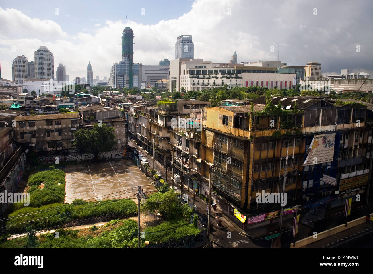 Street scene with old, run down, derelict building, and new modern ...