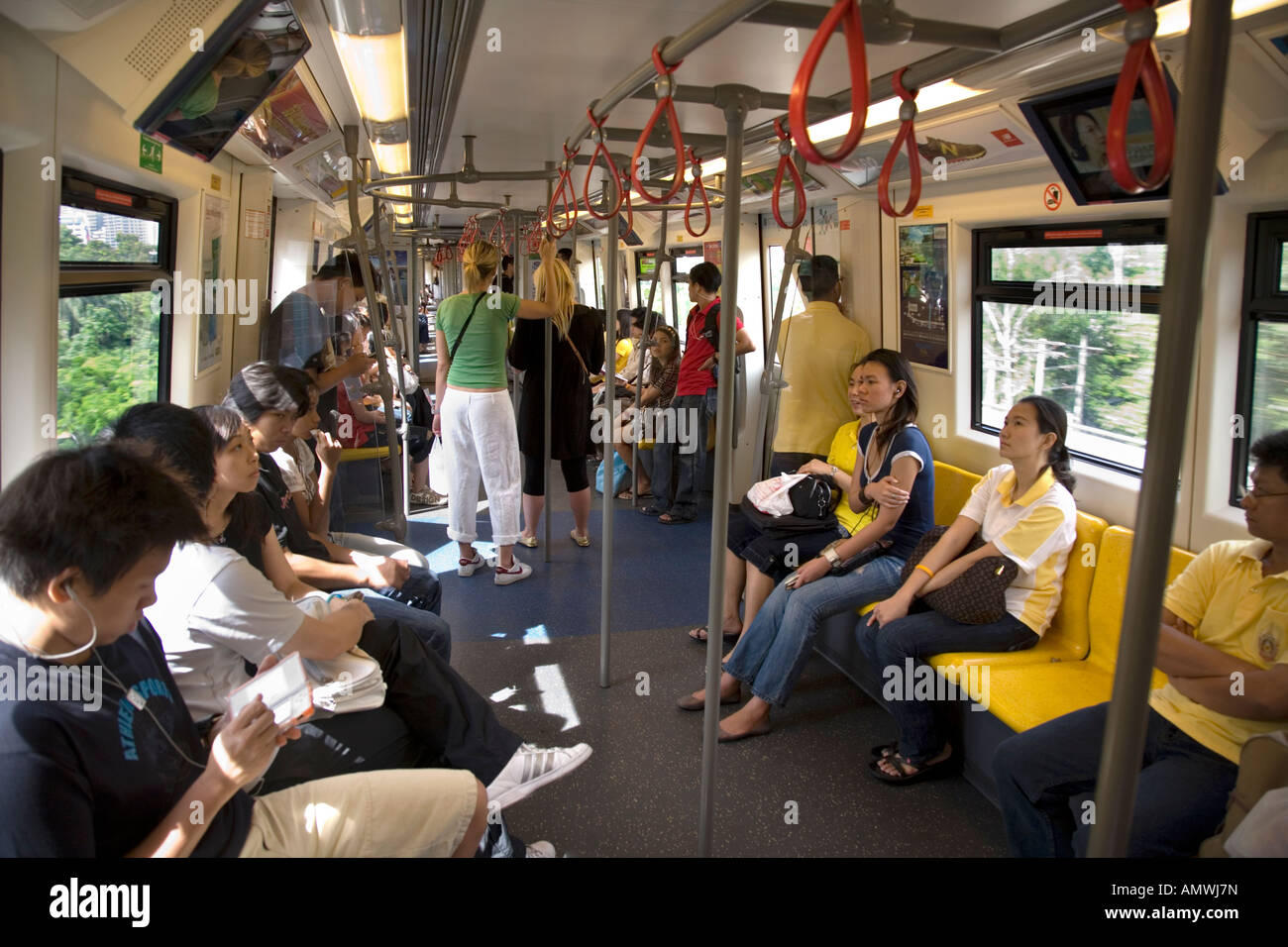 Passengers inside a Skytrain carriage. Bangkok, Thailand Stock Photo ...
