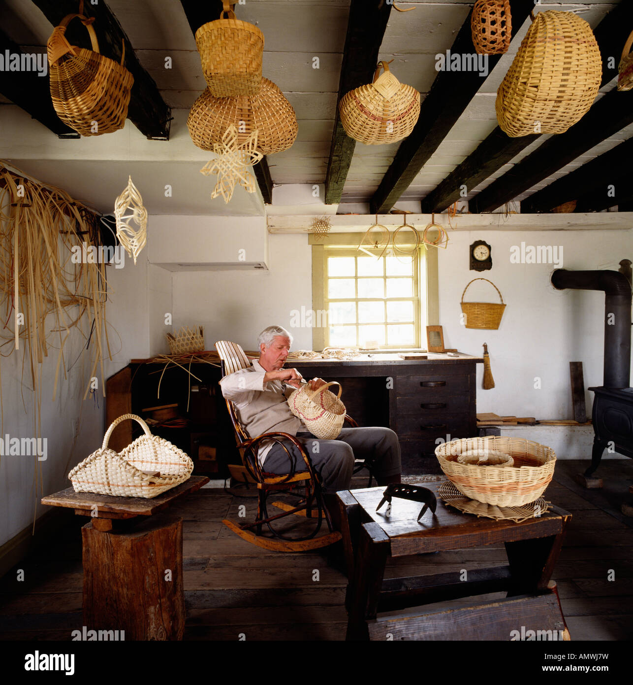A Basketmaker [Male] Weaves Baskets In A Shop In Old Bedford Village ...