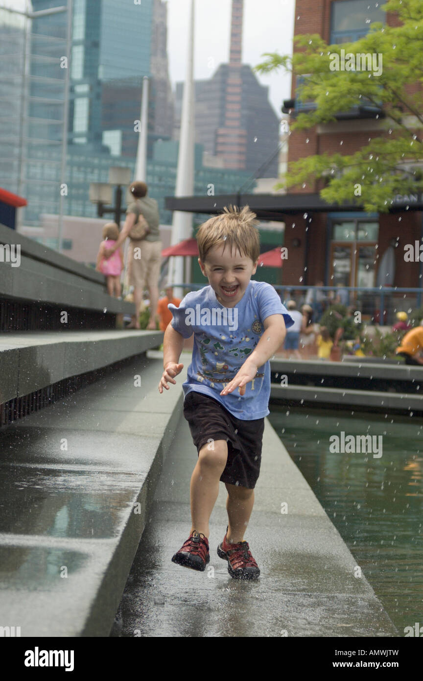 Running through the sprinkler hi-res stock photography and images - Alamy