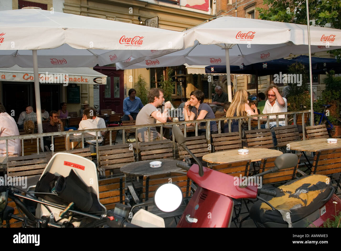 Germany Baden Wurttemberg Stuttgart People sitting at an outdoors cafe ...