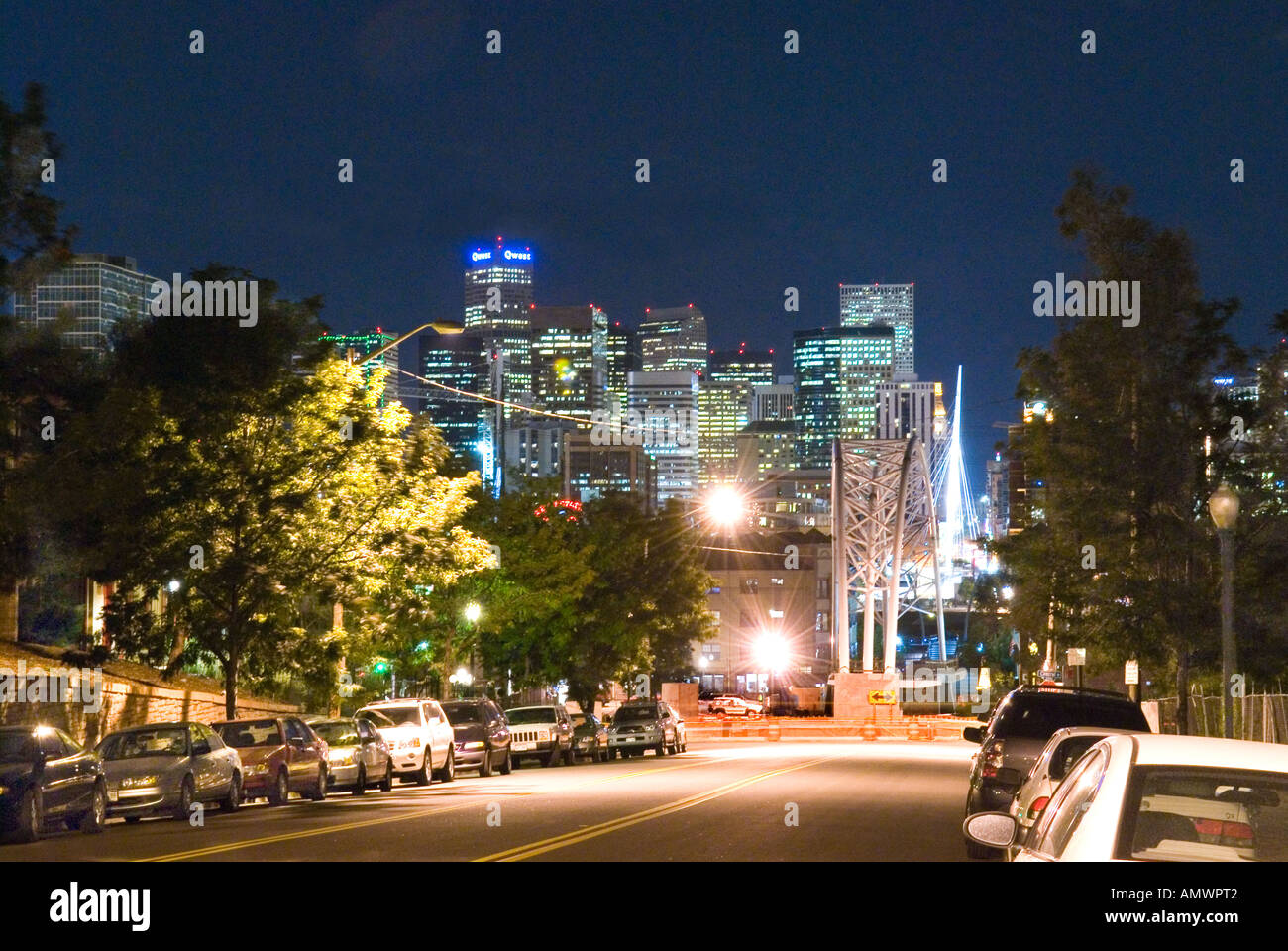 Metropolitan skyline night cars street trees lights west hi-res stock ...