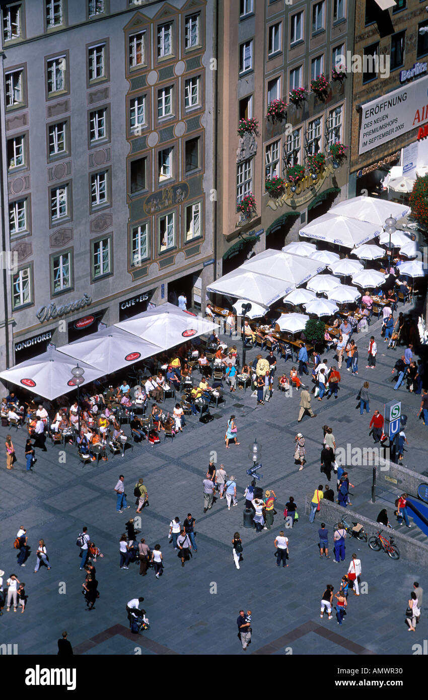 Germany Bavaria Munich An elevated view over a cafe and people at the City Hall at Marienplatz ...