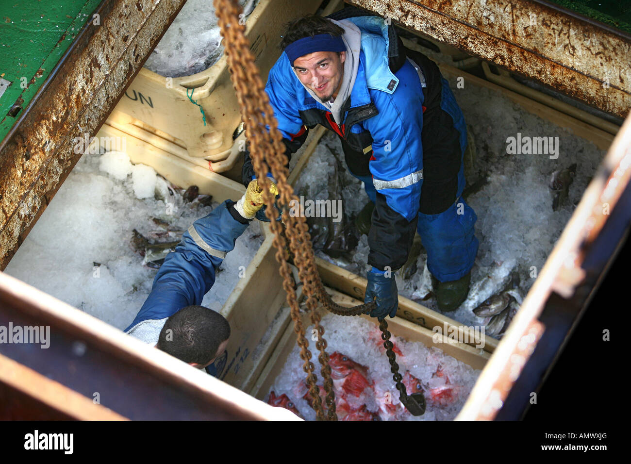 Seaman onboard a trawler in Iceland Stock Photo - Alamy