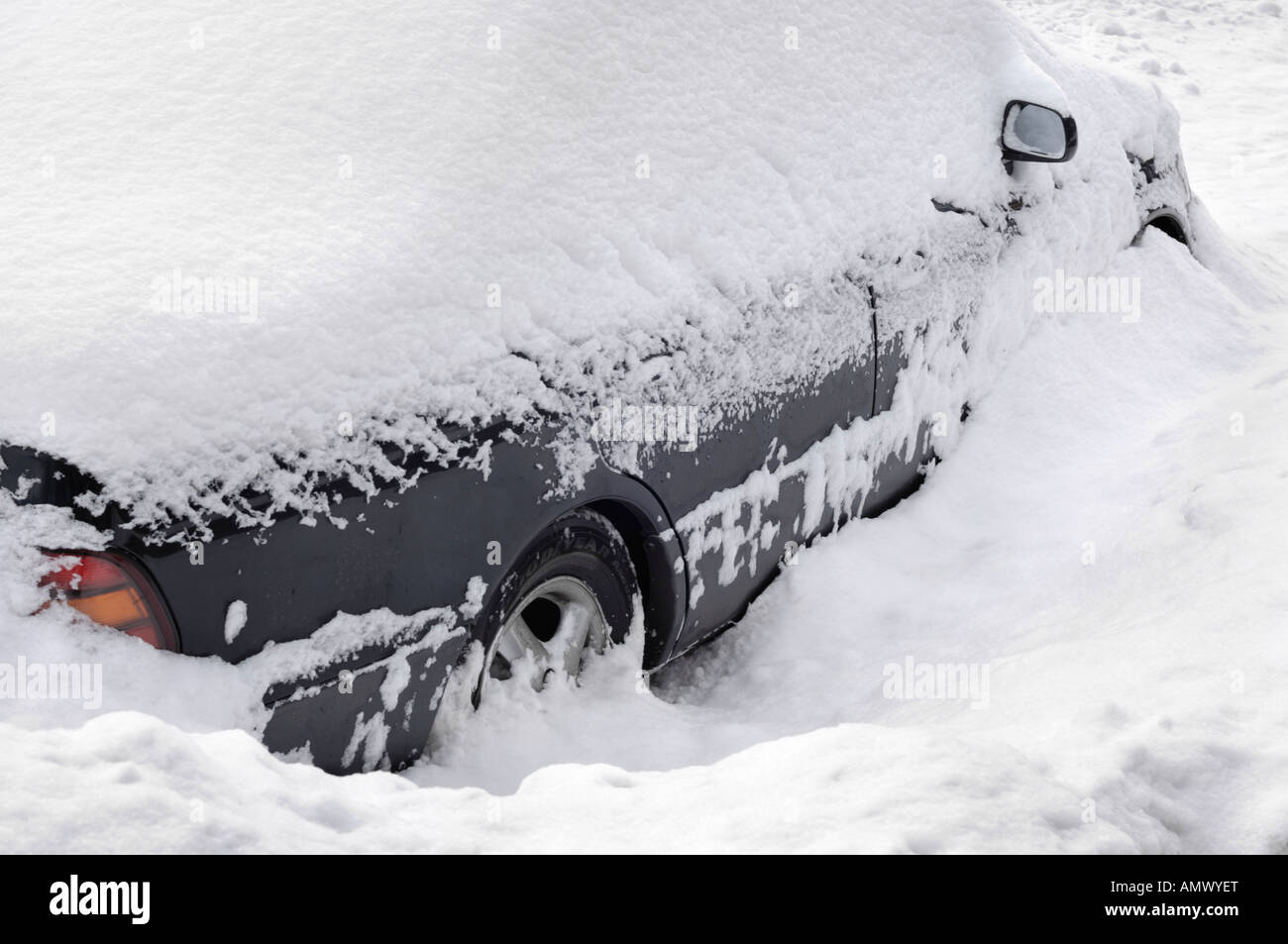 Car on the side of the road covered with snow Stock Photo - Alamy