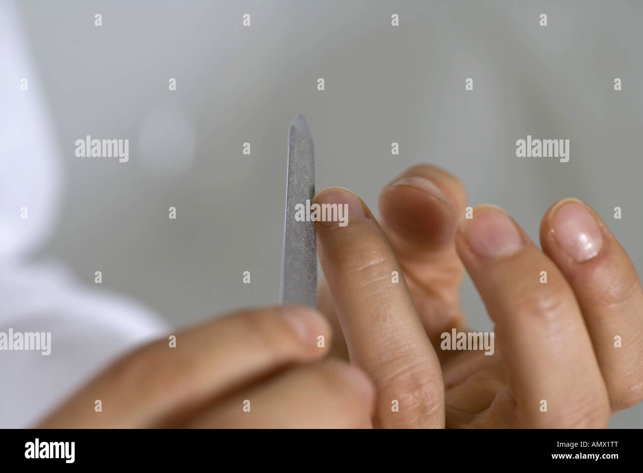 woman filing her nails Stock Photo - Alamy