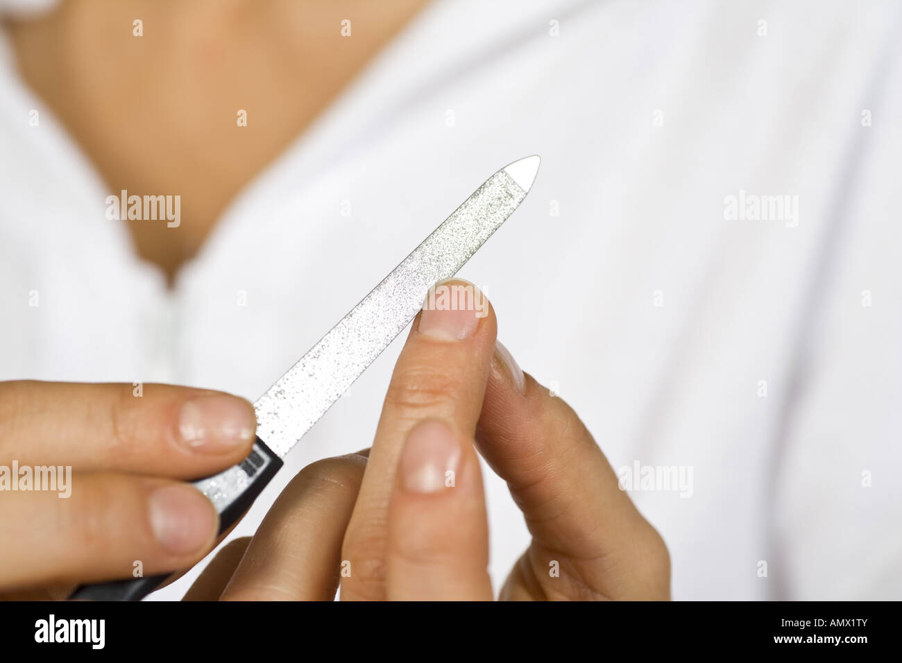 woman filing her nails Stock Photo - Alamy