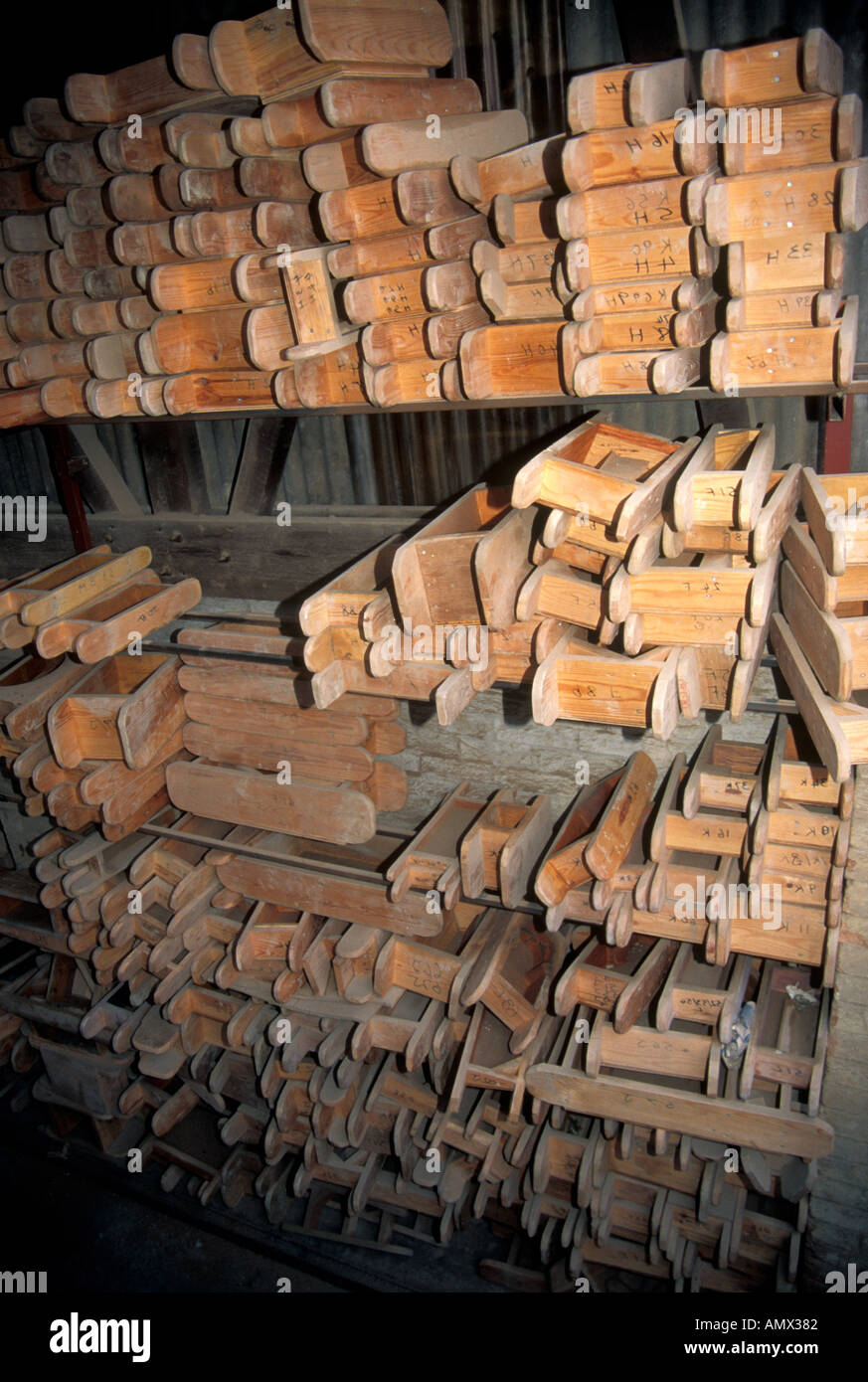 A stack of moulds made from wood for Brick making by hand in a ...
