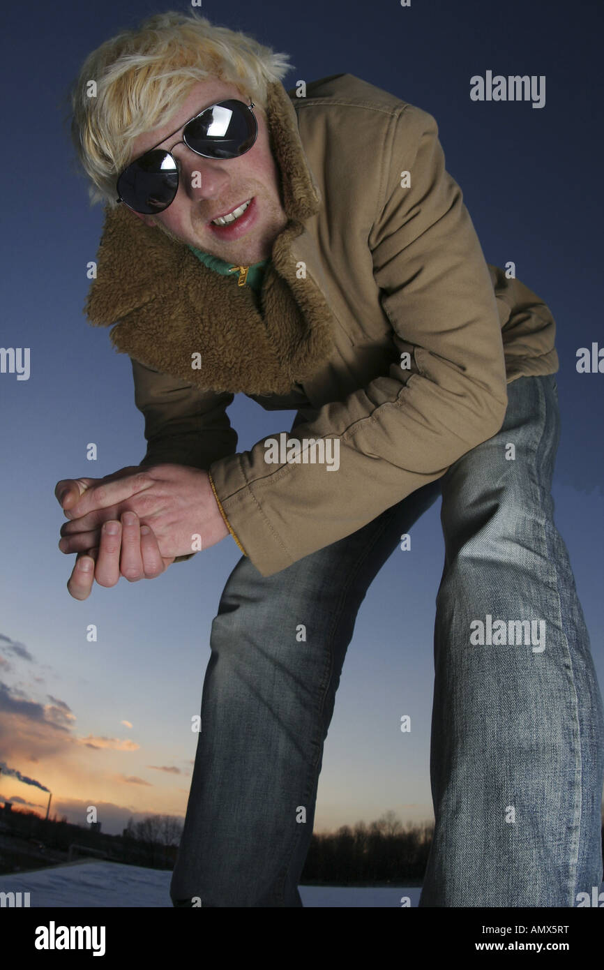 Young man bending forwards hi-res stock photography and images - Alamy