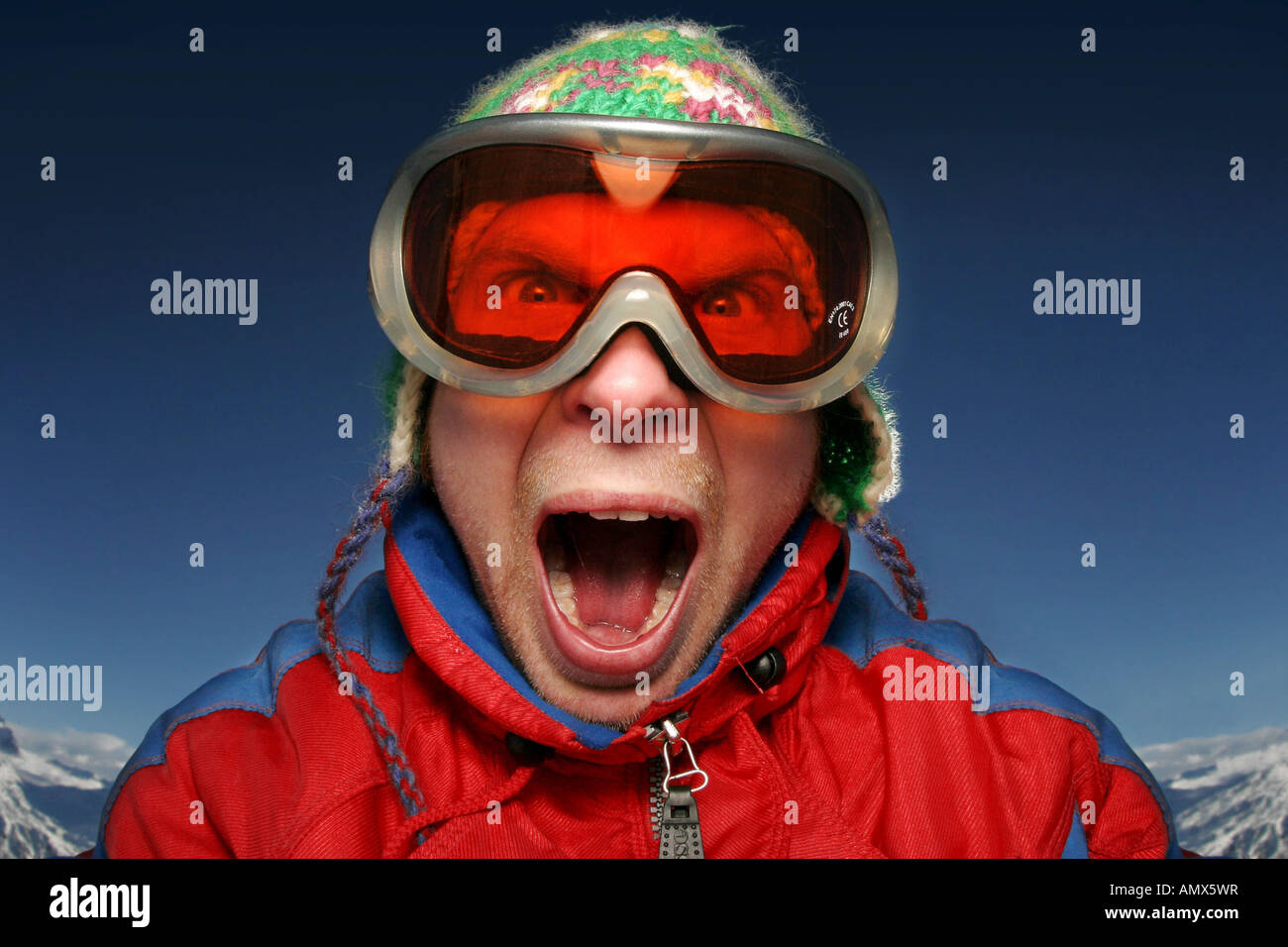 crazy young man with snow goggle, Austria, Alps Stock Photo - Alamy
