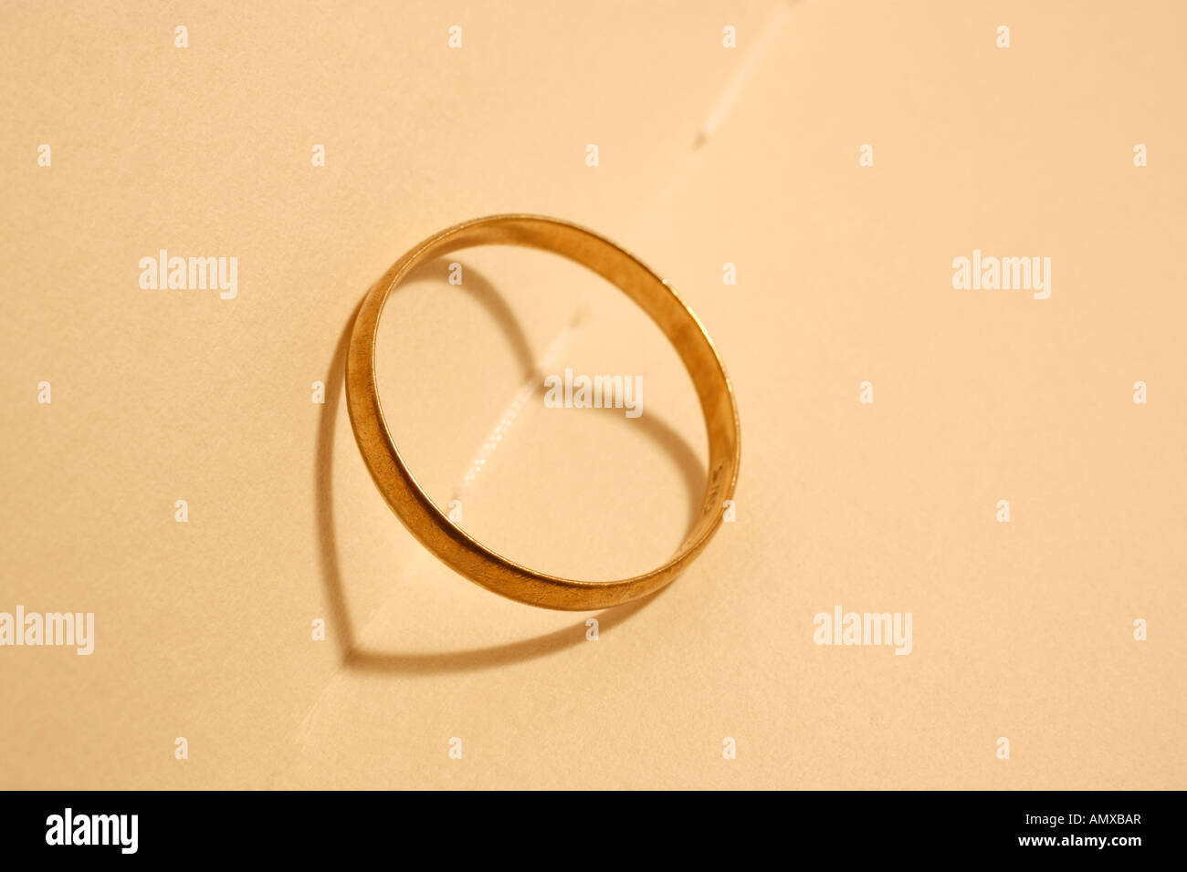 Symbolic heart shaped shadow of a ring Stock Photo - Alamy