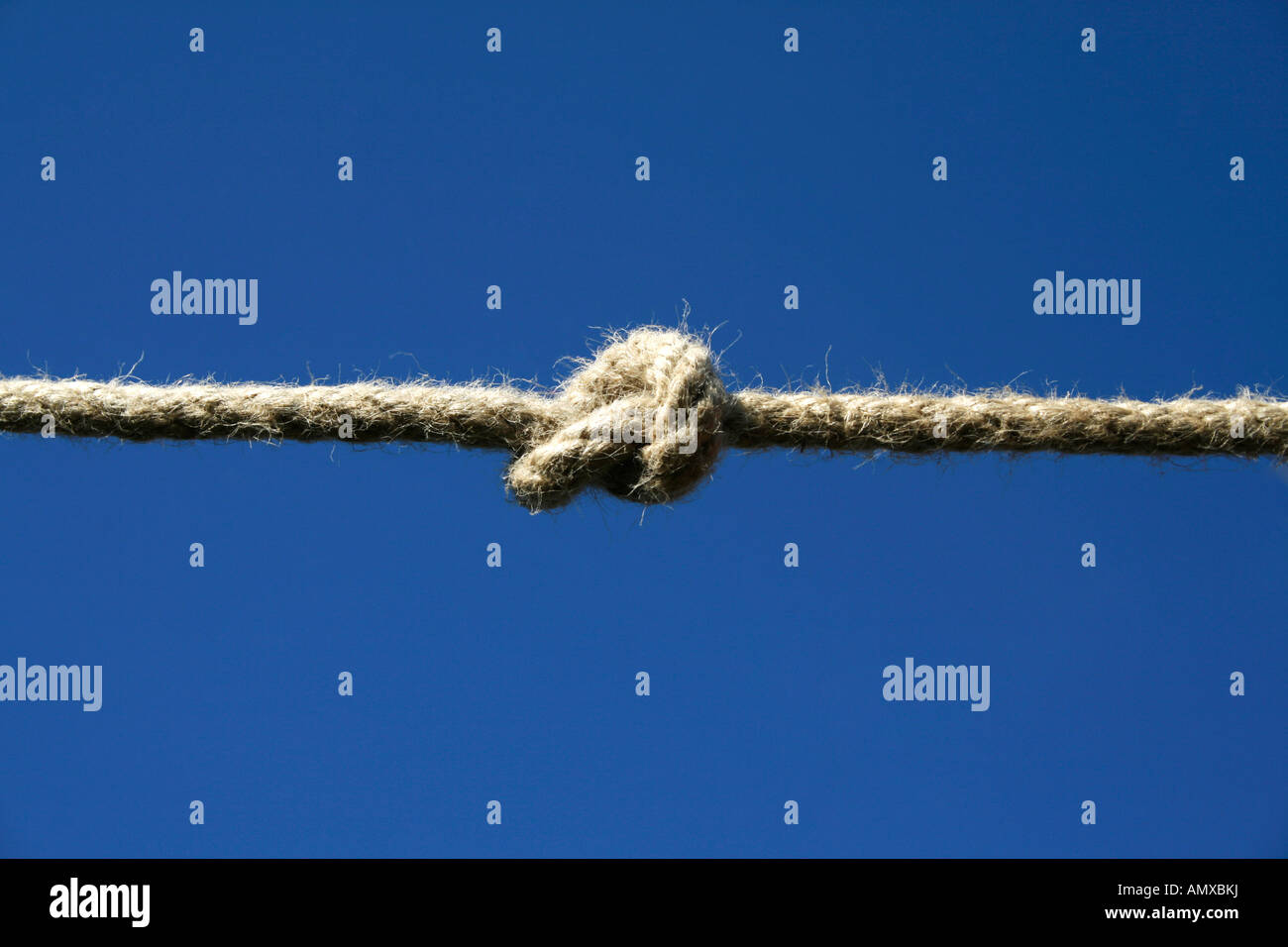 A tight knot in a rope Stock Photo - Alamy