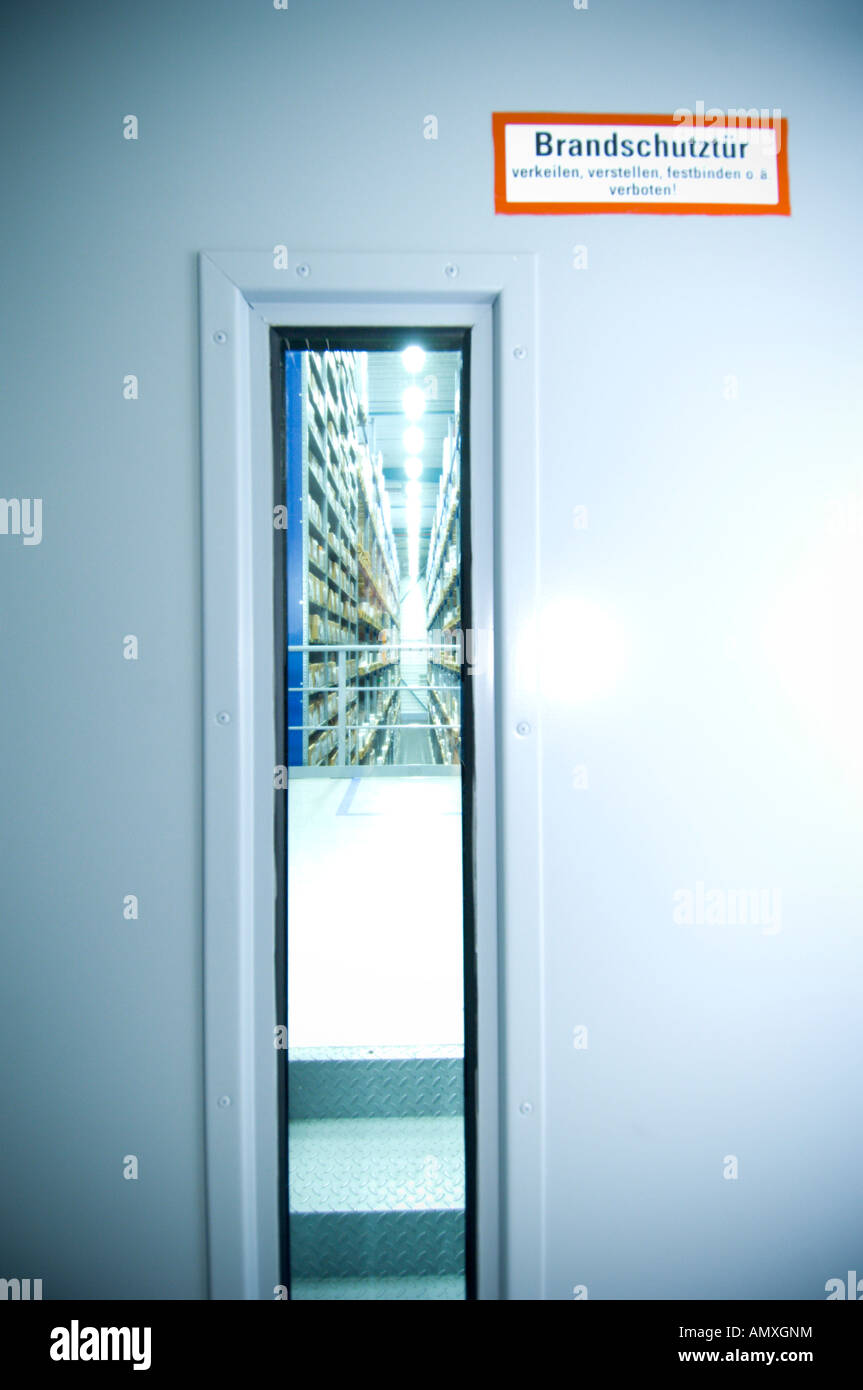 Signboard near glass window of door in factory, Germany Stock Photo - Alamy