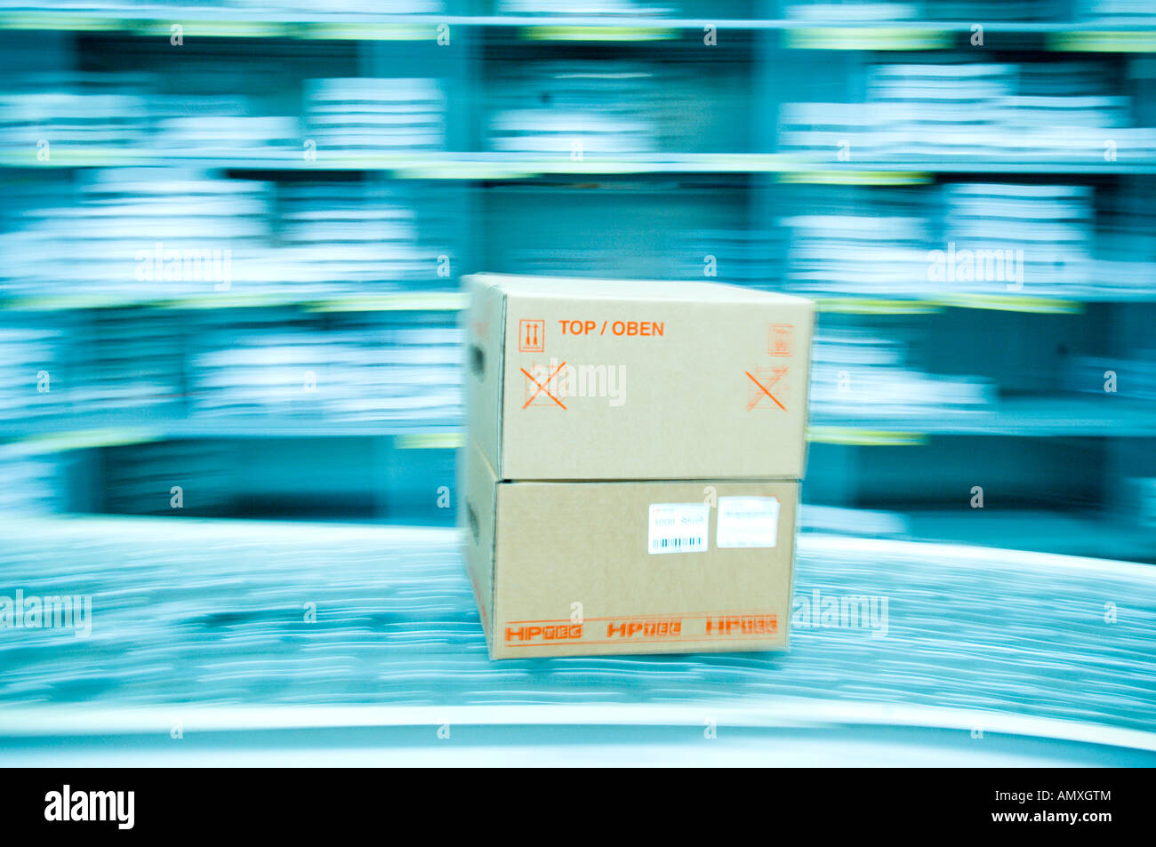 Cartons on assembly line inside warehouse, Weingarten, Baden ...