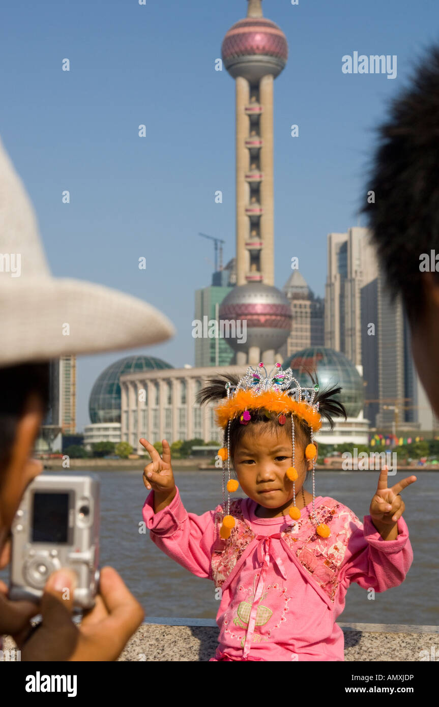 China Shanghai The Bund Waitan young child in pink clothes pausing ...