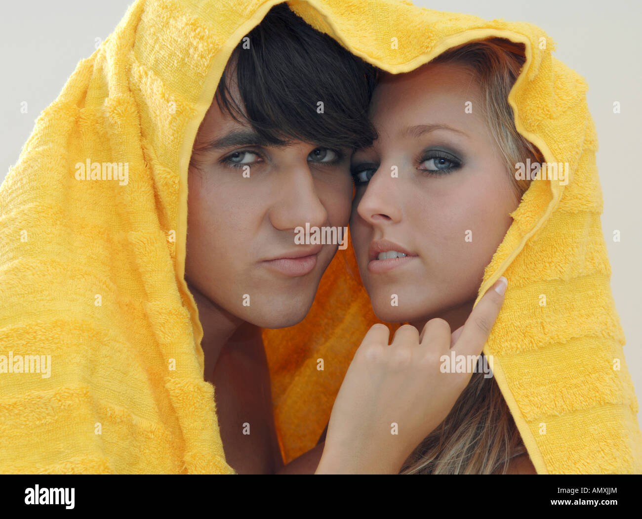 Couple together under a bath towel Stock Photo - Alamy