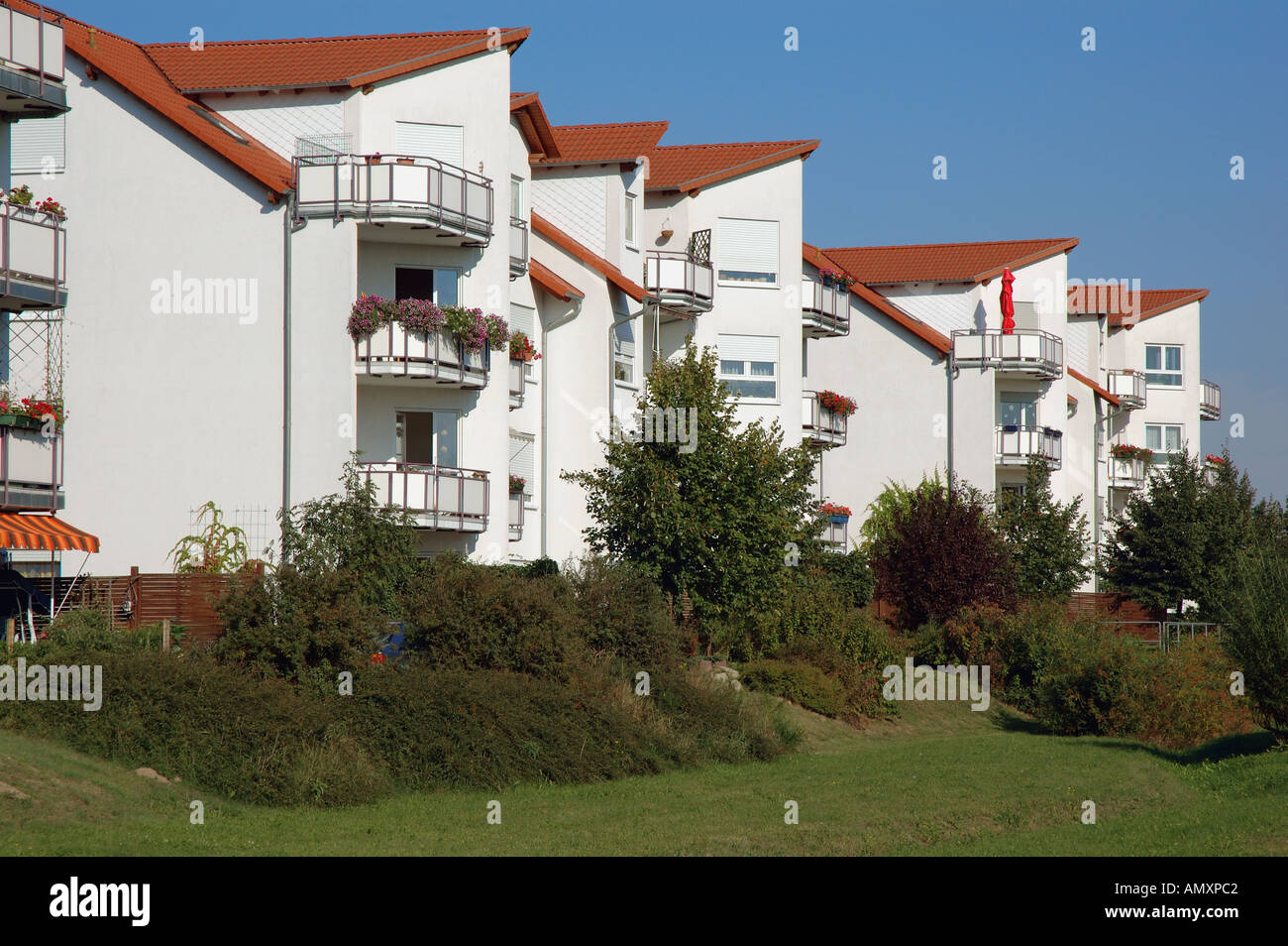 New building settlement with a family and terraced houses Stock Photo ...