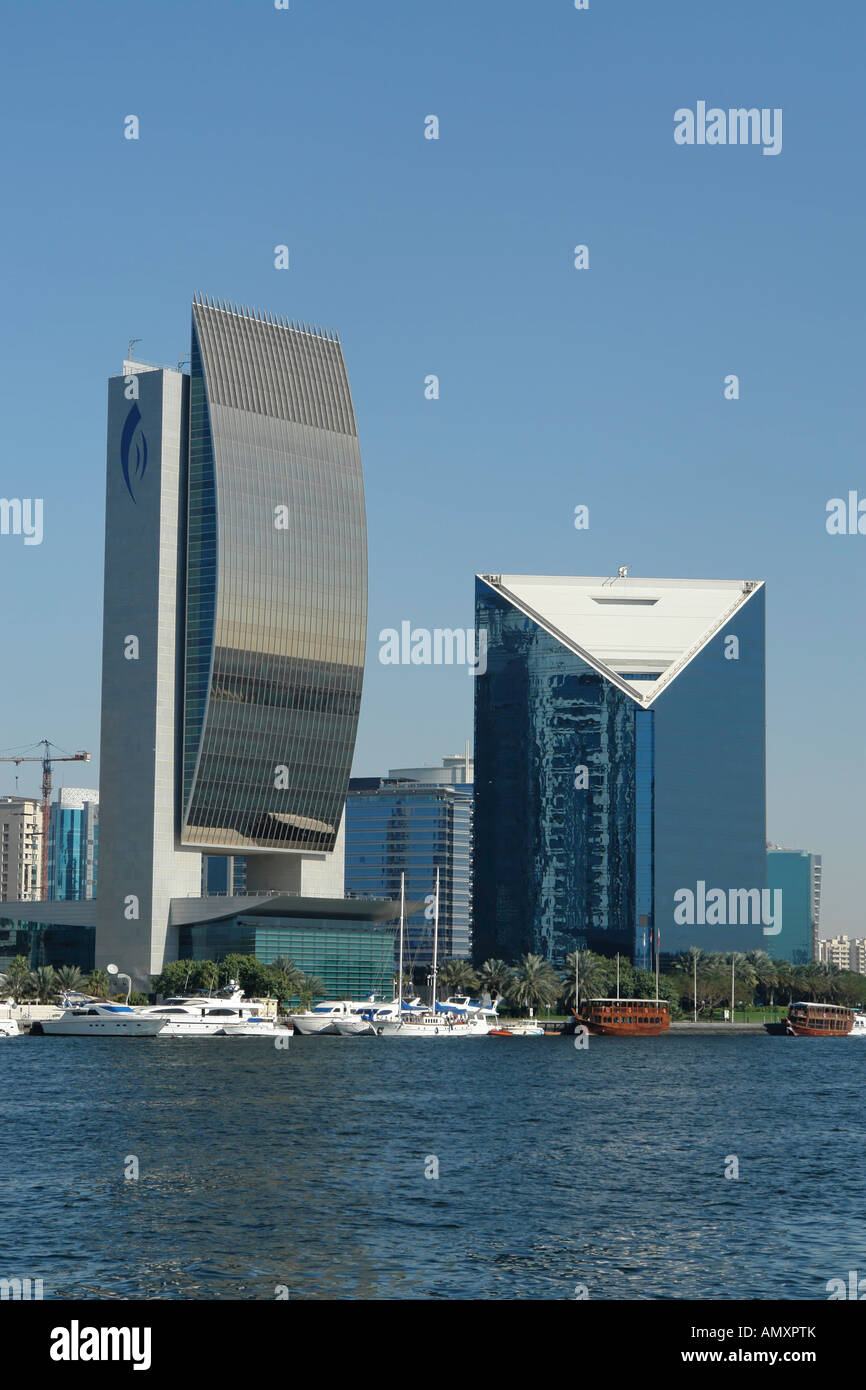 Buildings at waterfront against clear blue sky, Dubai Creek, Dhow ...