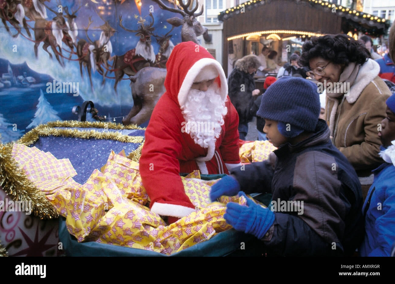 Santa Claus selling gifts at Christmas fair Frankfurt Germany Stock ...
