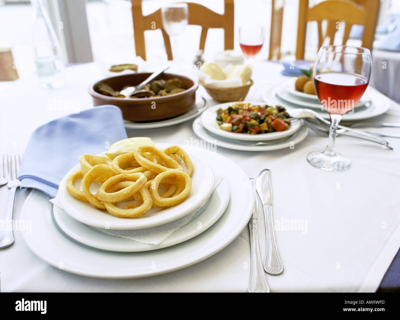 Calamari on a table in a restaurant hi-res stock photography and images ...