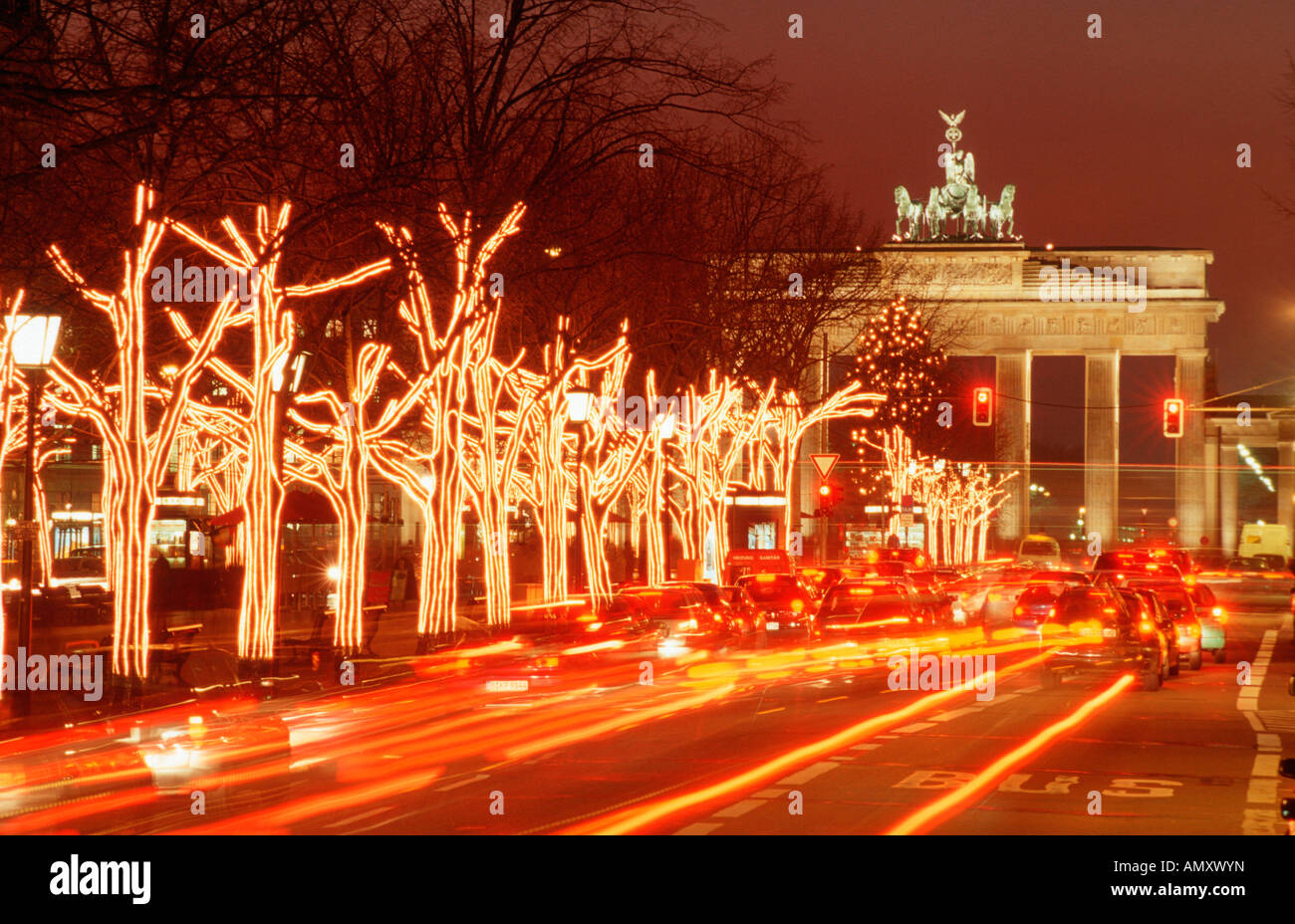Christmas trees lit up in front of archway, Brandenburg Gate, Pariser ...