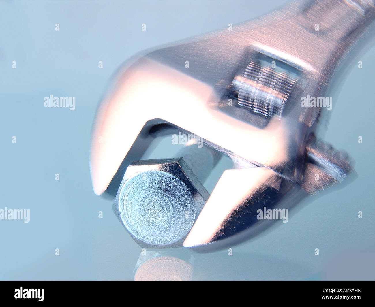 Close-up of adjustable wrench and nut Stock Photo - Alamy