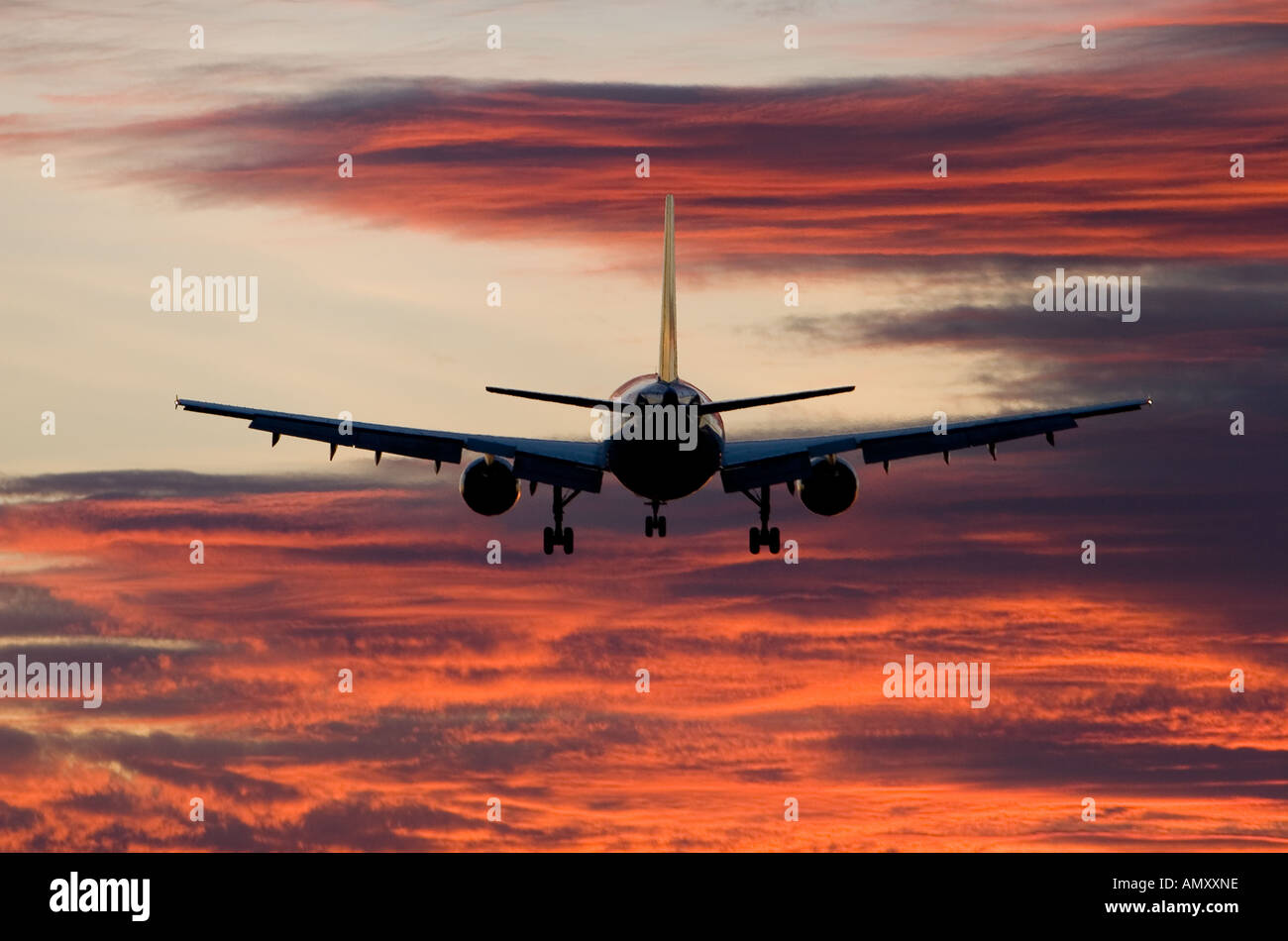 Firey sky landing or departure Stock Photo - Alamy