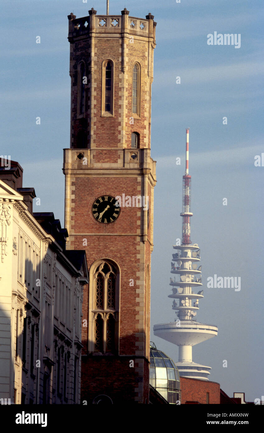 Clock tower in front of communication tower Stock Photo - Alamy